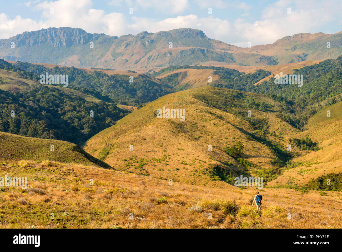 A hiker observes stunning views in Zimbabwe's Nyanga National Park ...