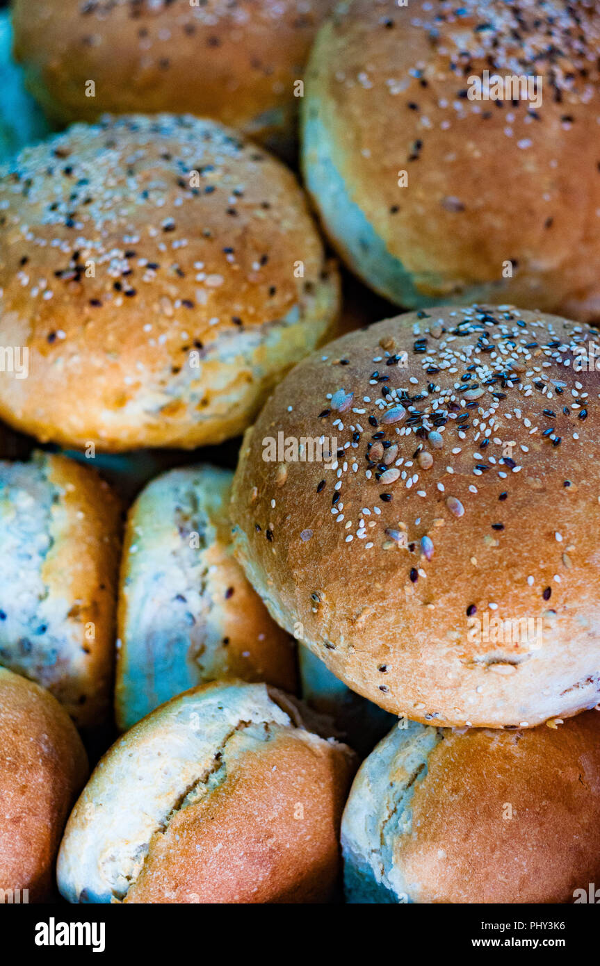 Close-up of a pile of multigrain-coated "brun pav" loaves (hard-crust ...