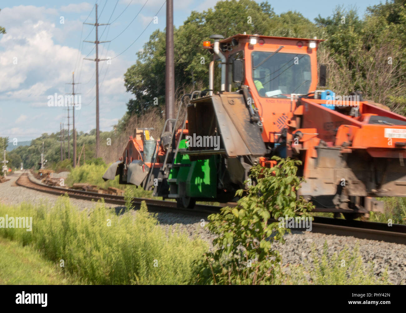 a heavy machine installs the new rail road ties Stock Photo - Alamy