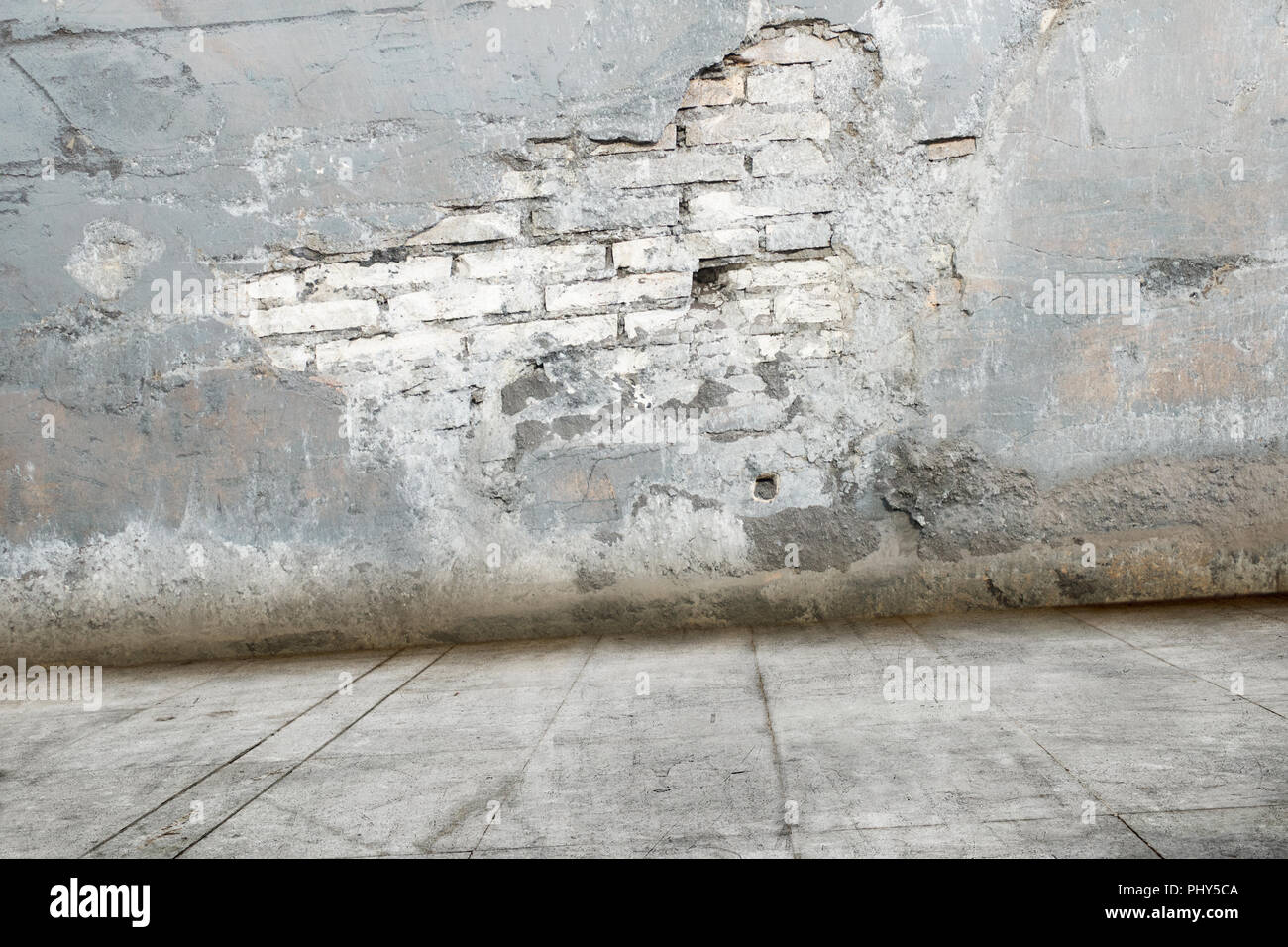 Ruined brick wall with dirty floor. Halloween background Stock Photo ...