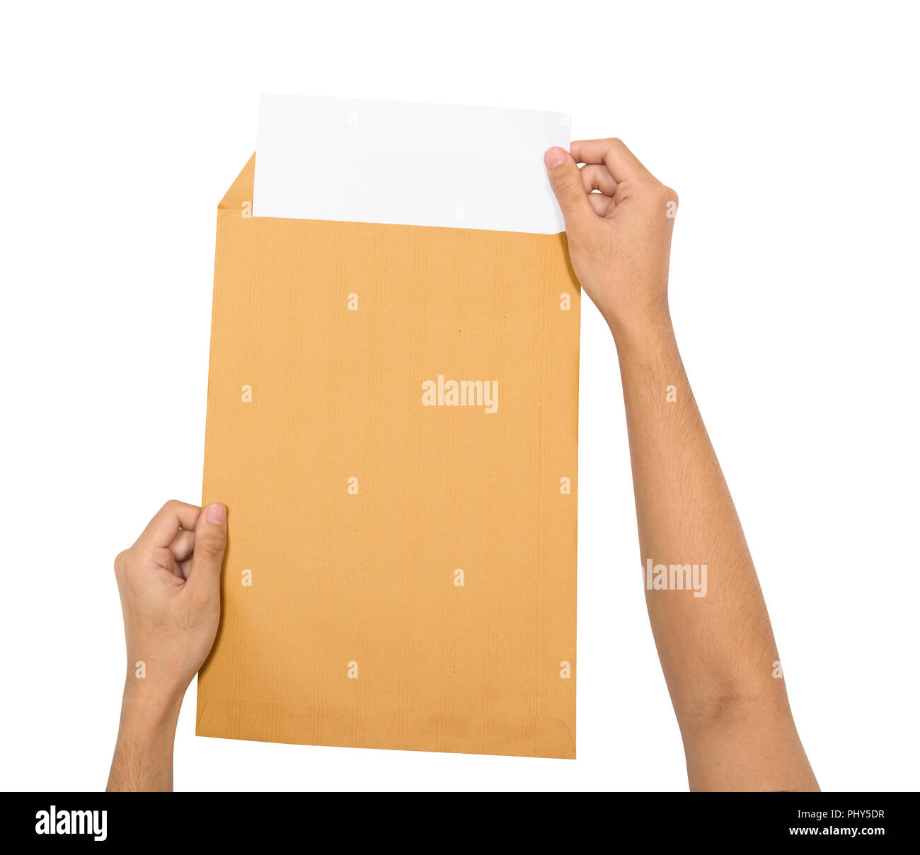 Hands insert the paper into brown envelope isolated over white ...
