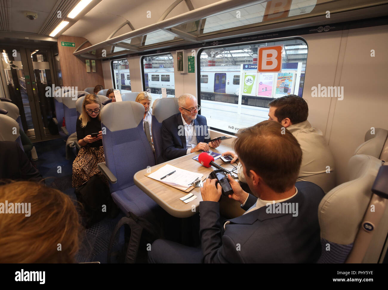 Labour leader Jeremy Corbyn on a train at Liverpool Lime Street Station ...