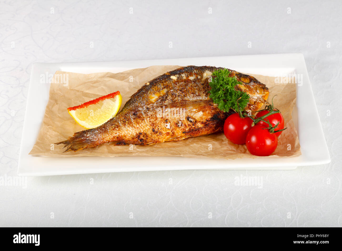 Roasted dorada fish Stock Photo - Alamy