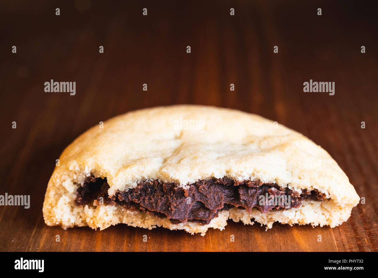 Chocolate filled cookies cut in half with chocolate cream with copy ...