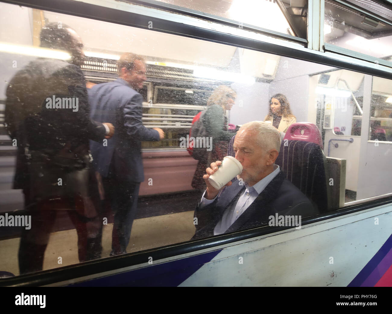 Labour leader Jeremy Corbyn o a train at Manchester Victoria Station ...