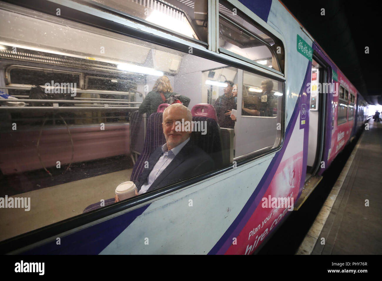 Labour leader Jeremy Corbyn o a train at Manchester Victoria Station ...