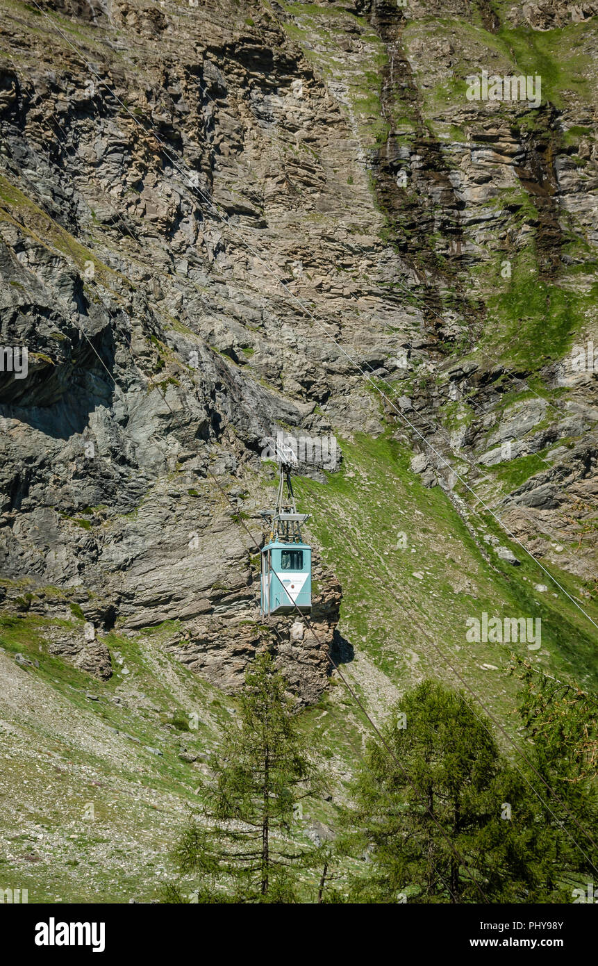 Single Cable car hanging in Swiss Alps Stock Photo - Alamy