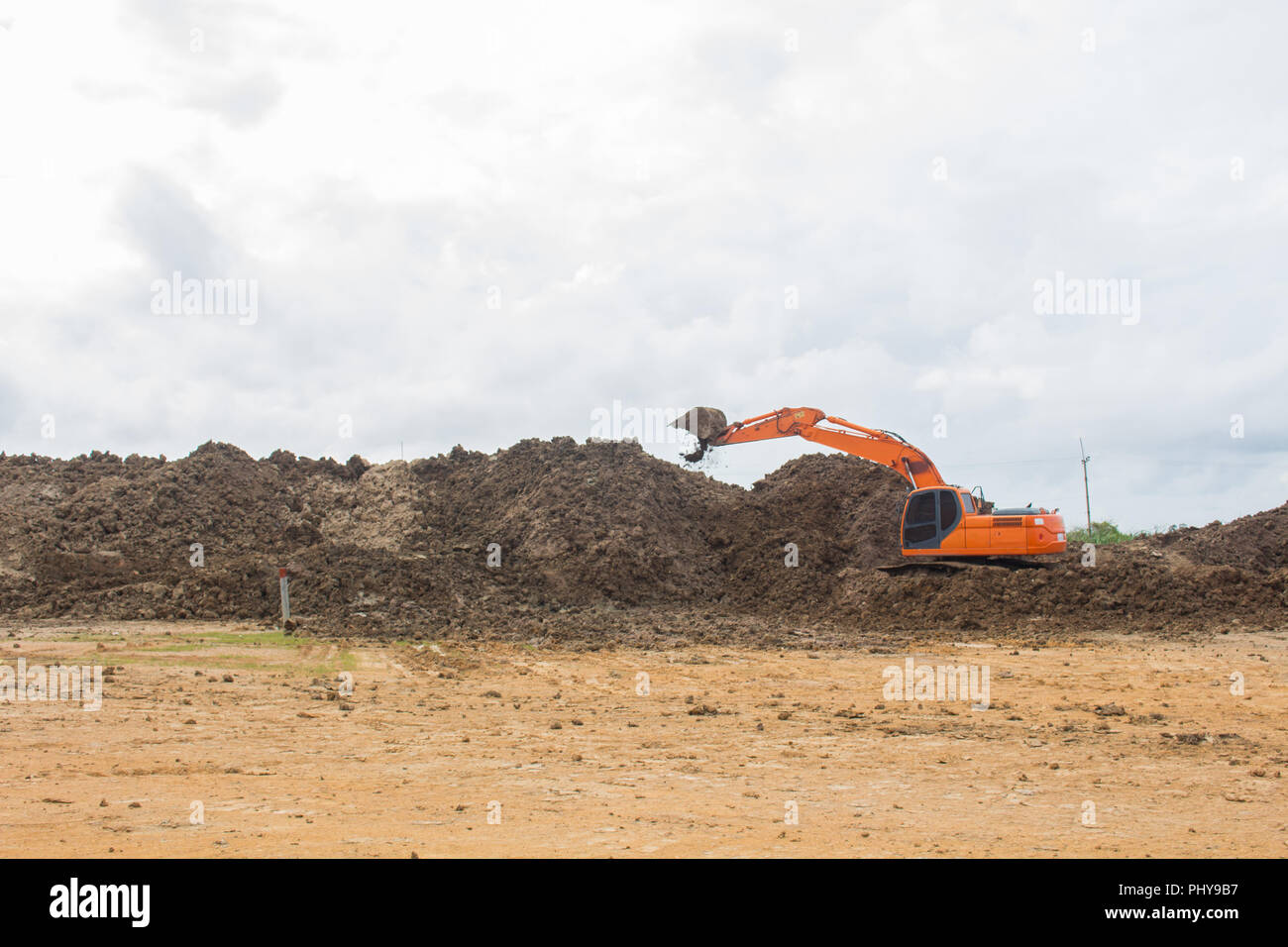 large diesel mechanical excavator digging earth machine at excavation ...