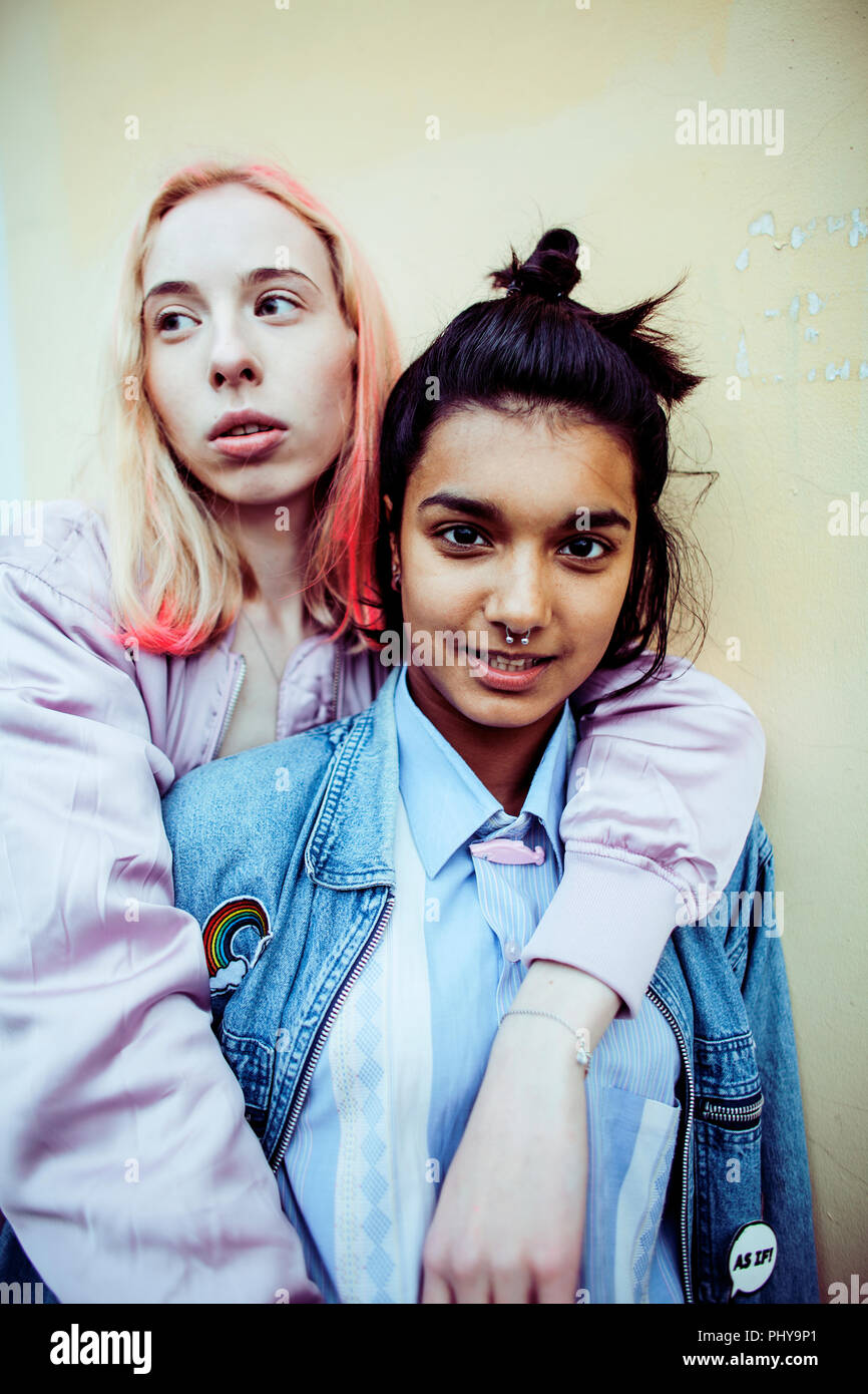 Two teenage girls infront of university building smiling, having Stock ...