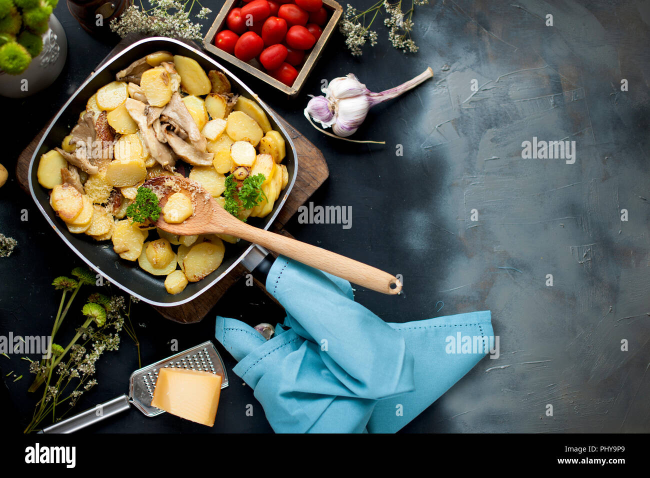 Fried potatoes in a frying pan with creepers and spices. Delicious ...