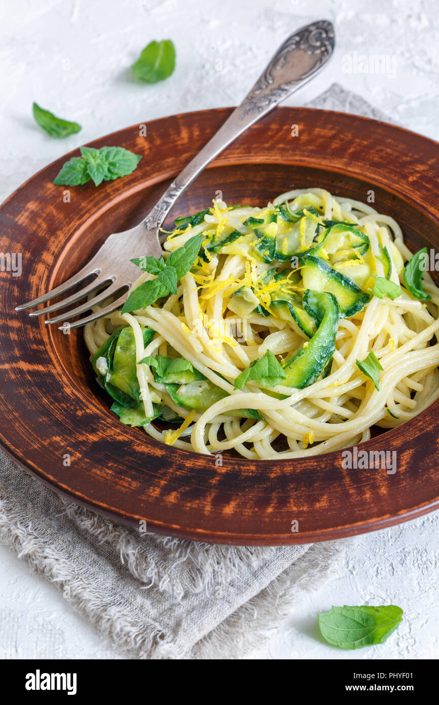 Pasta with cream sauce, zucchini and lemon zest Stock Photo - Alamy