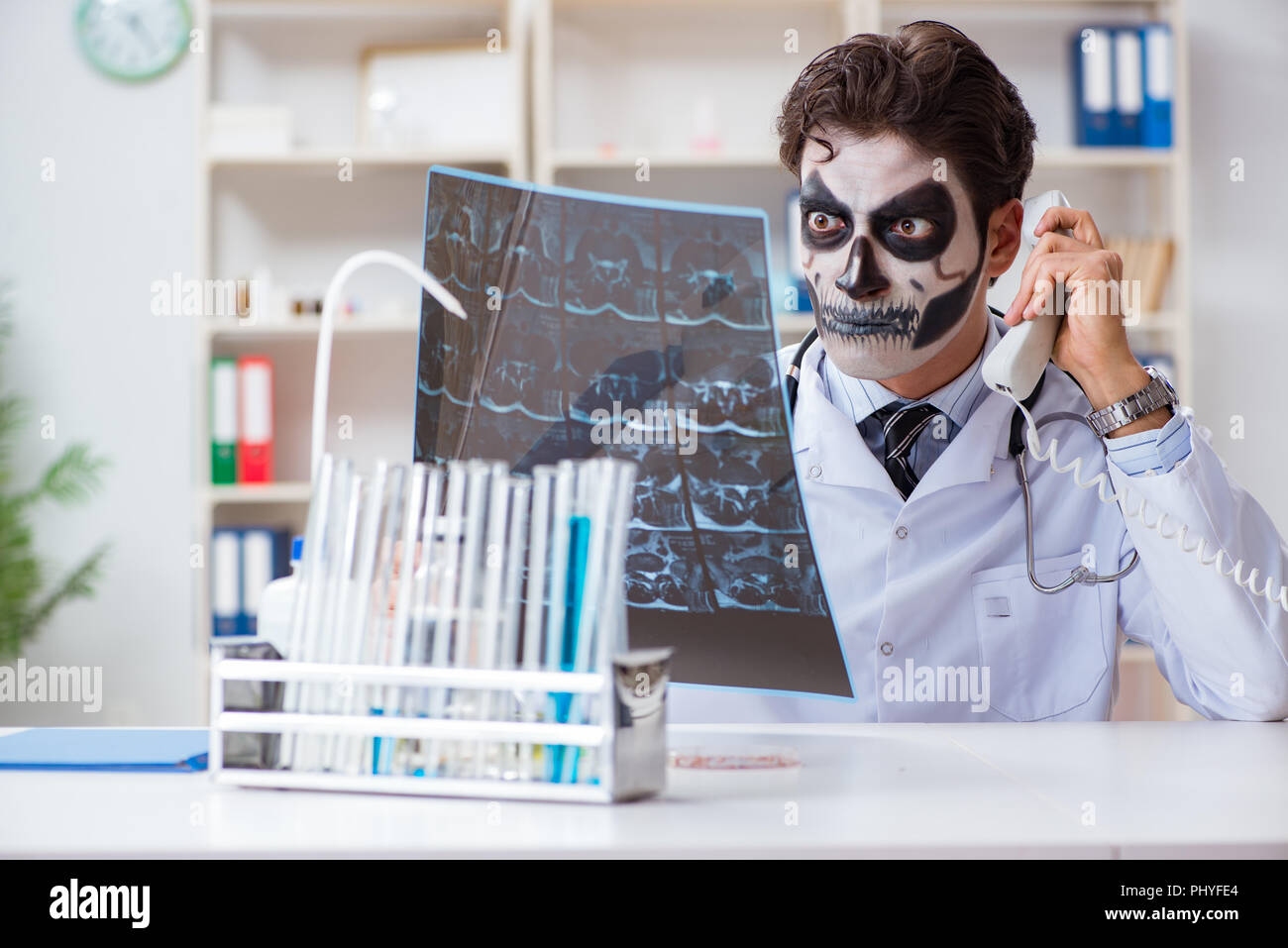 Scary monster doctor working in lab Stock Photo - Alamy