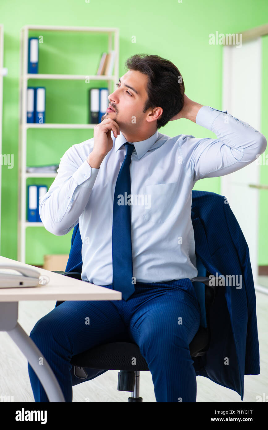 Employee doing exercises during break at work Stock Photo - Alamy