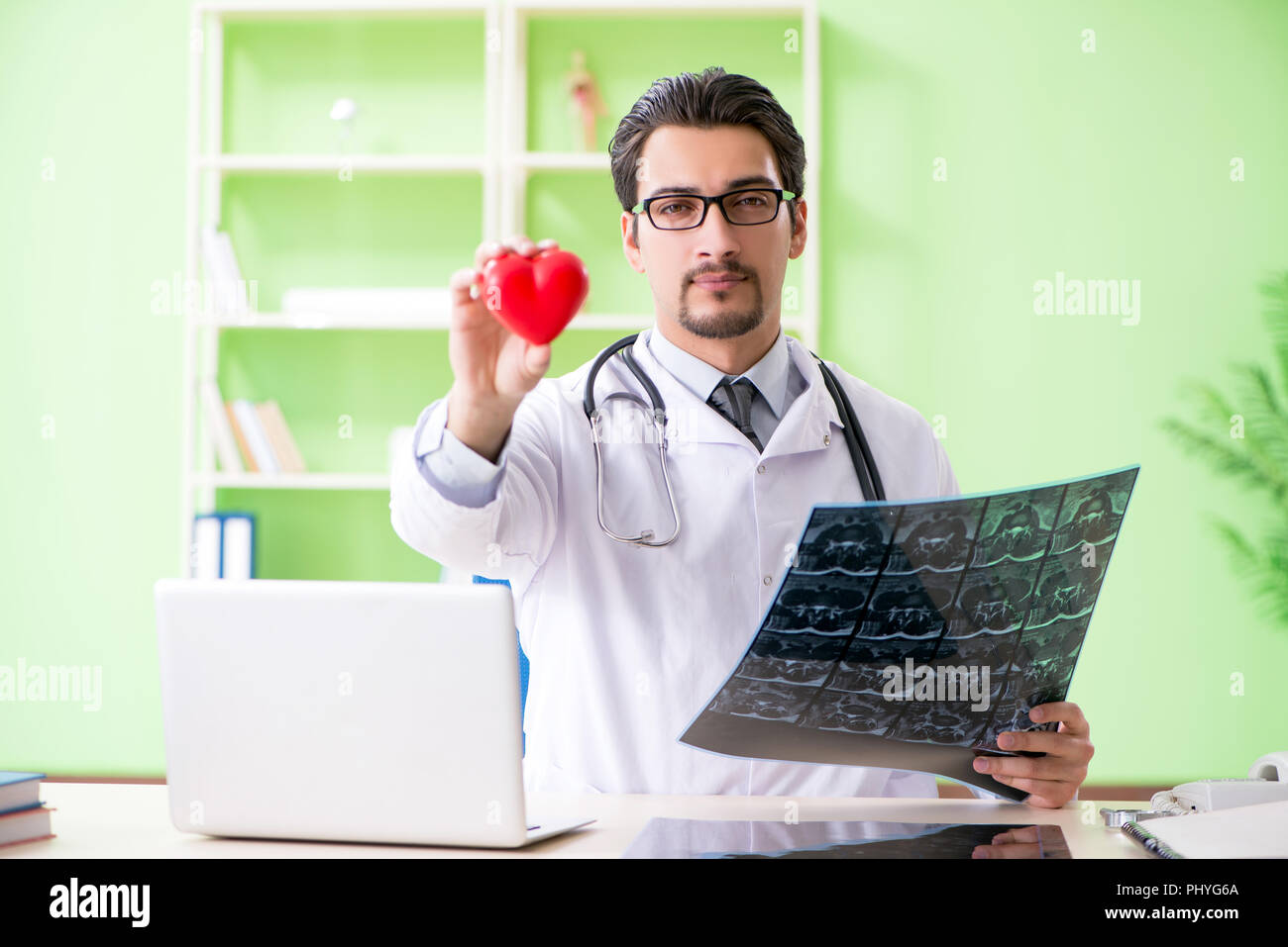 Doctor radiologist looking at x-ray scan in hospital Stock Photo - Alamy