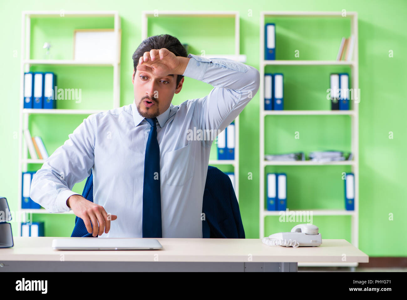 Employee doing exercises during break at work Stock Photo - Alamy