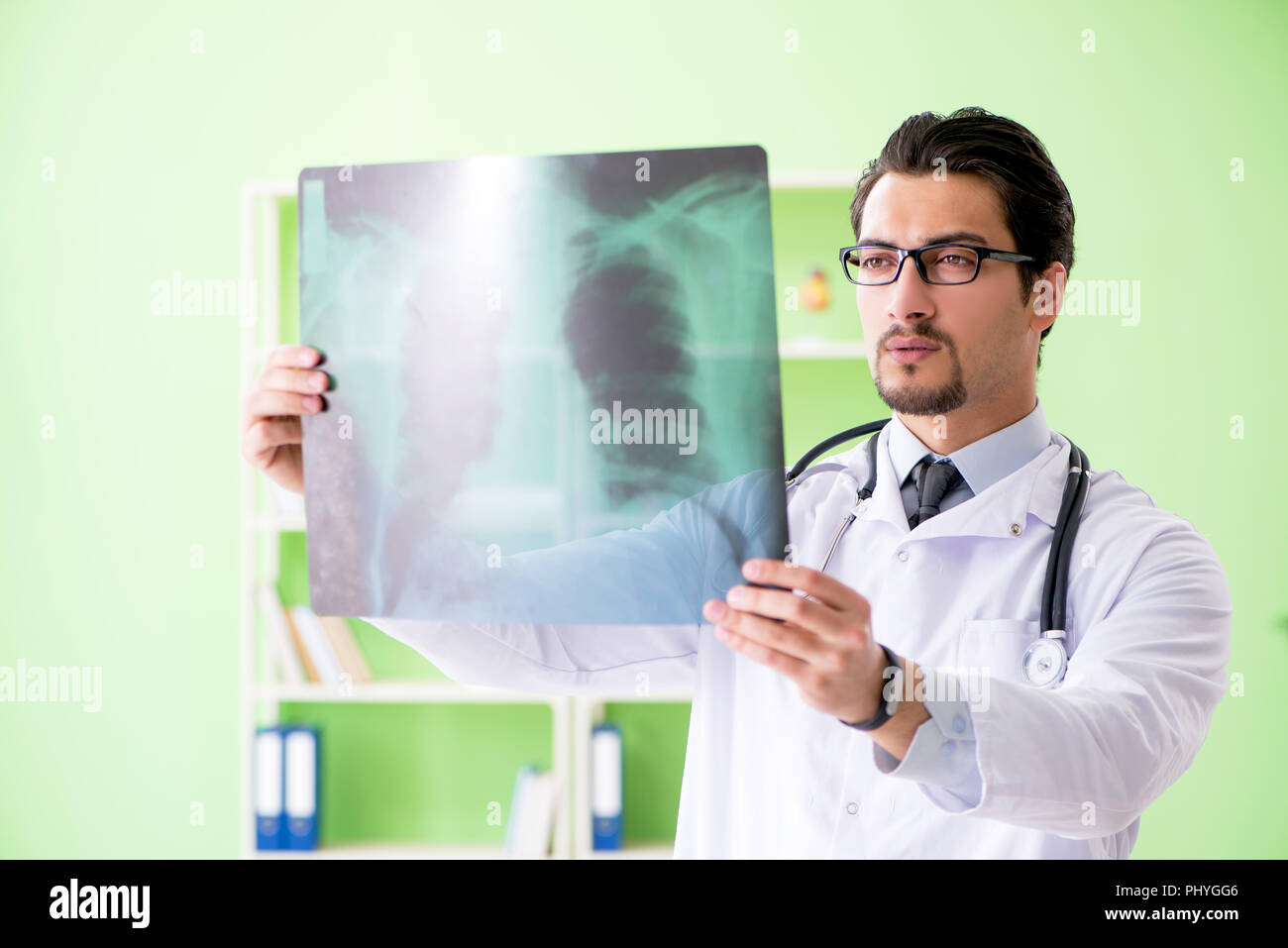 Doctor radiologist looking at x-ray scan in hospital Stock Photo - Alamy