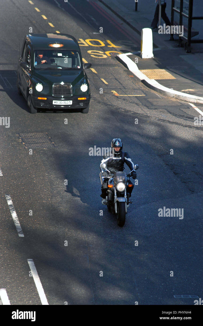Cab following motorcycle hi-res stock photography and images - Alamy