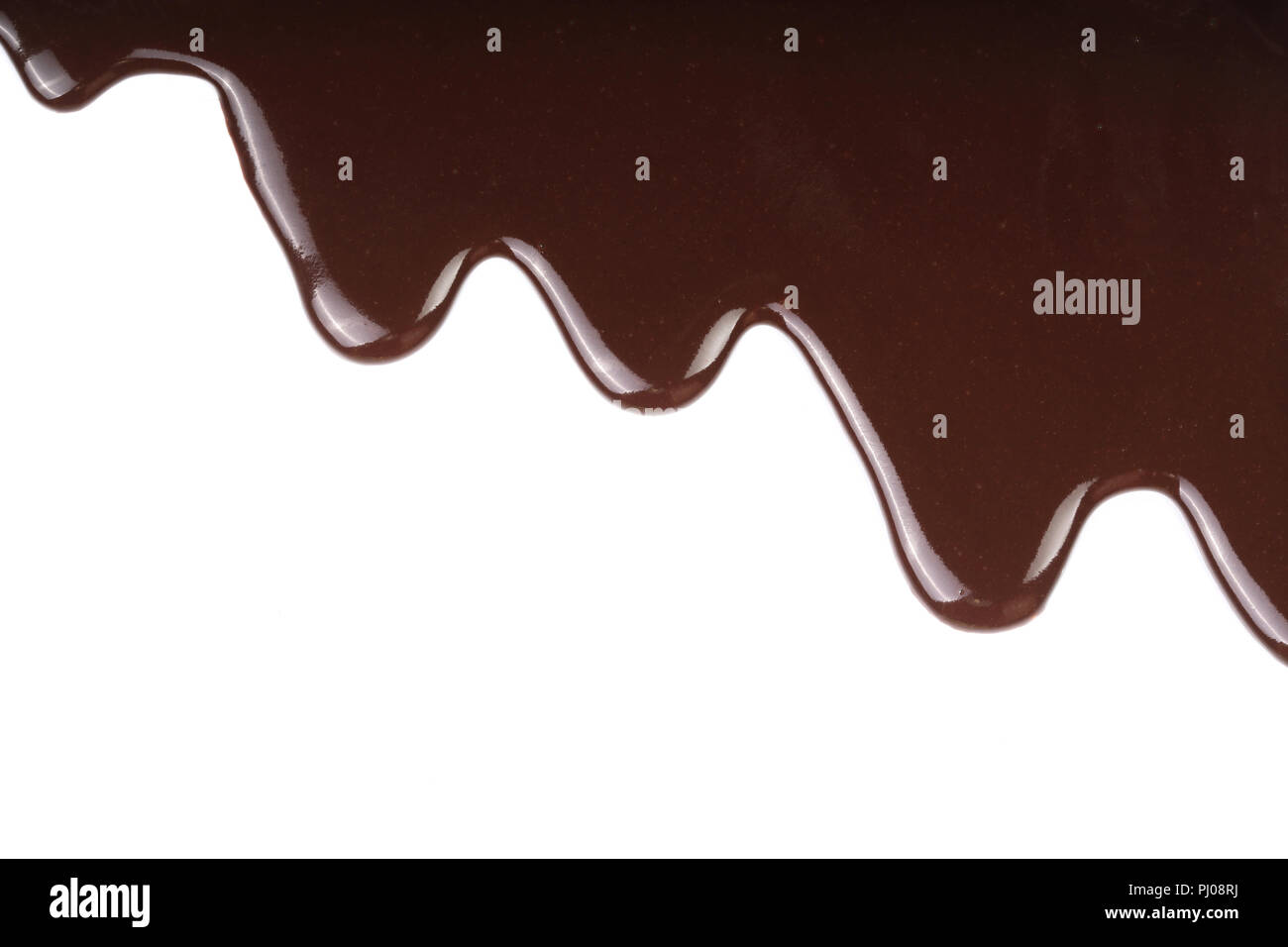 Melted chocolate dripping isolated on white background Stock Photo - Alamy