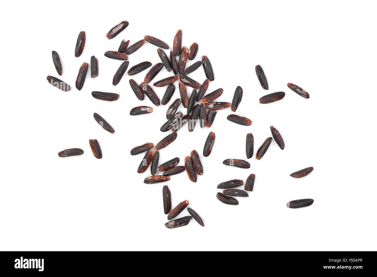 Black wild rice isolated on white background close up. Top view. Flat ...