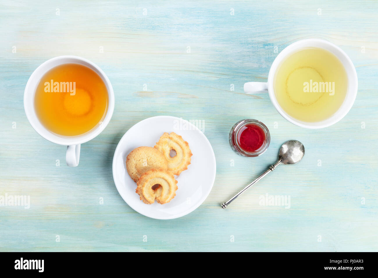An overhead photo of tea, on a teal background with copy space Stock ...