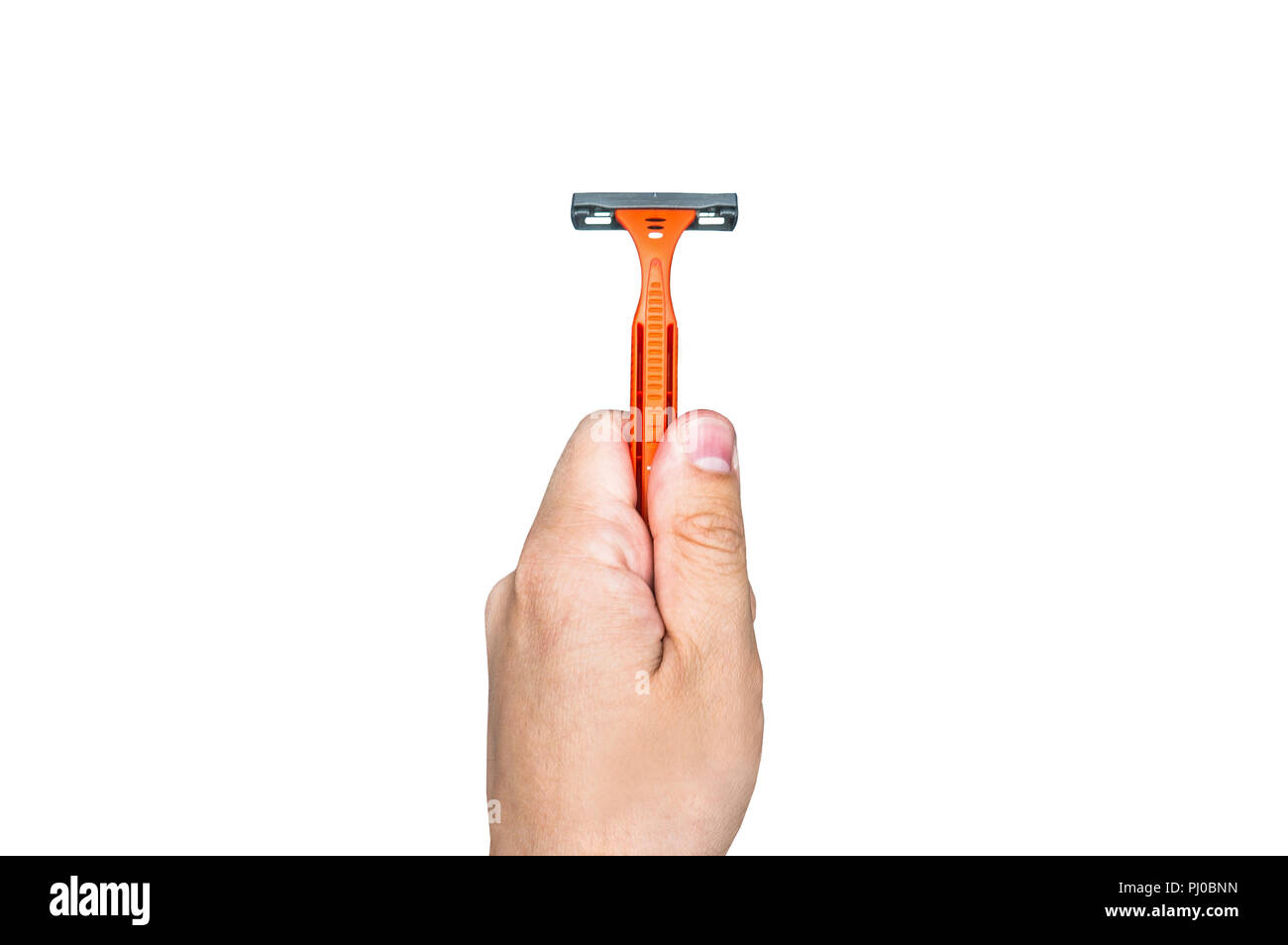 disposable orange razor orange color in a human hand isolated on white ...