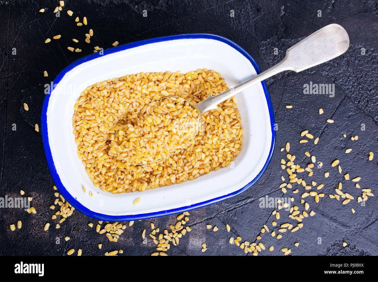 bulgur in bowl, raw bulgur, diet food Stock Photo - Alamy
