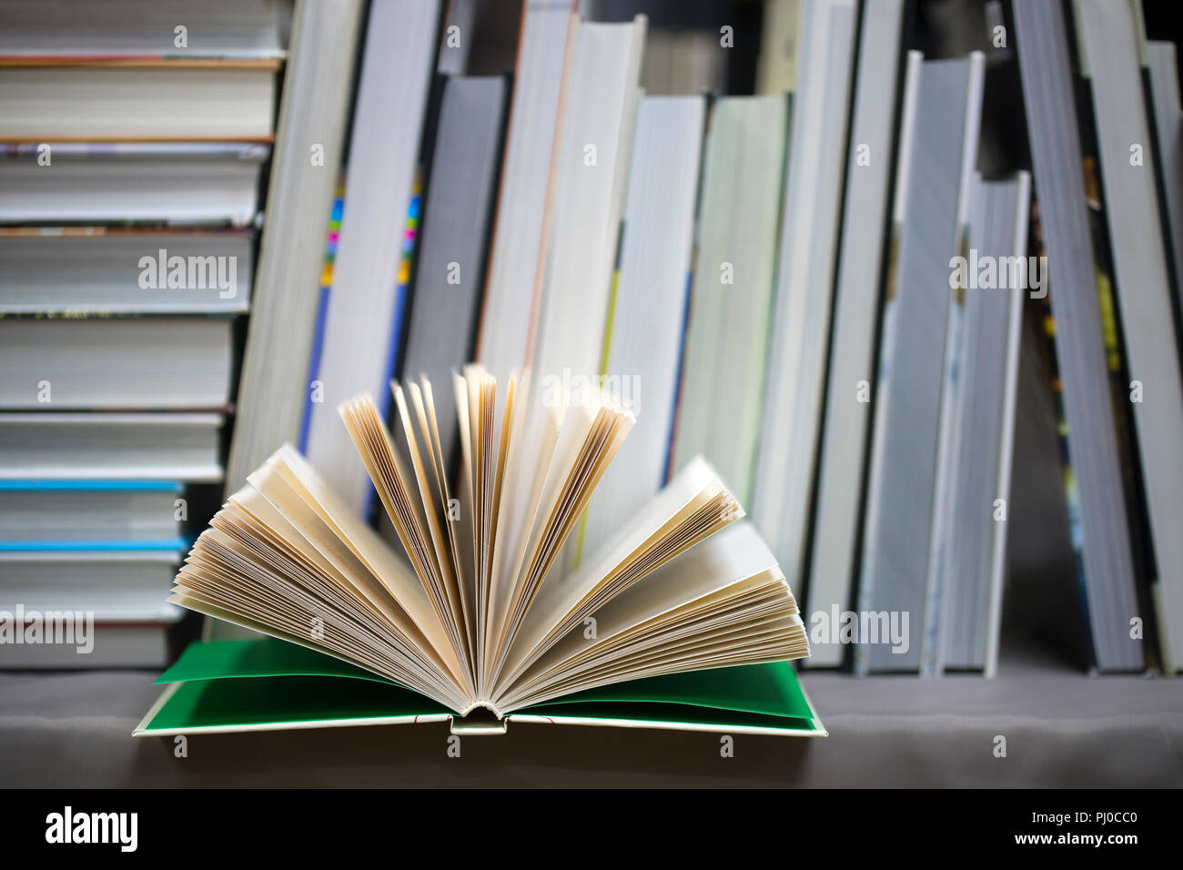 Open Book Stack Of Hardback Books On Table Top View Stock Photo Alamy