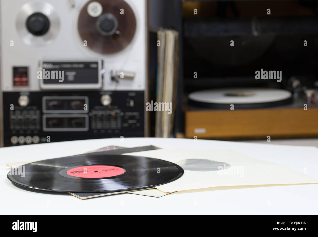 Vinyl record with copy space in front of a collection albums dummy ...