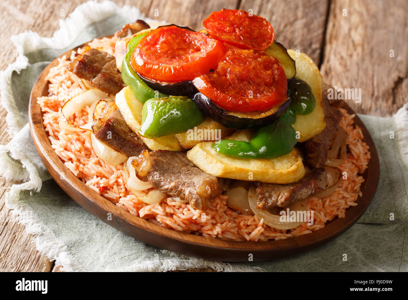 Summer Arabic dinner rice with beef, eggplant, pepper, onions and ...