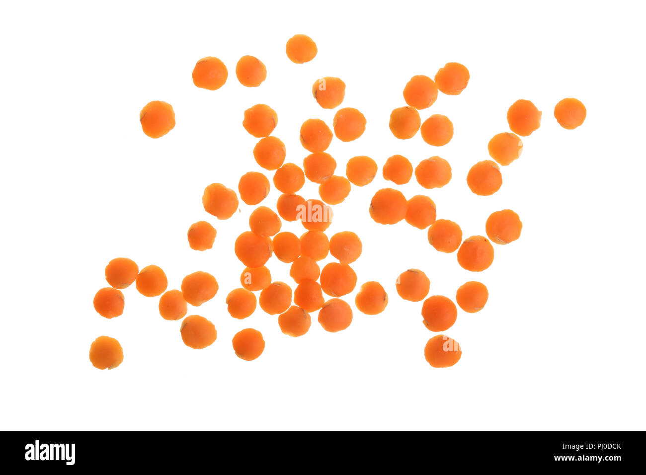 Heap of raw red lentils isolated on white background Stock Photo - Alamy