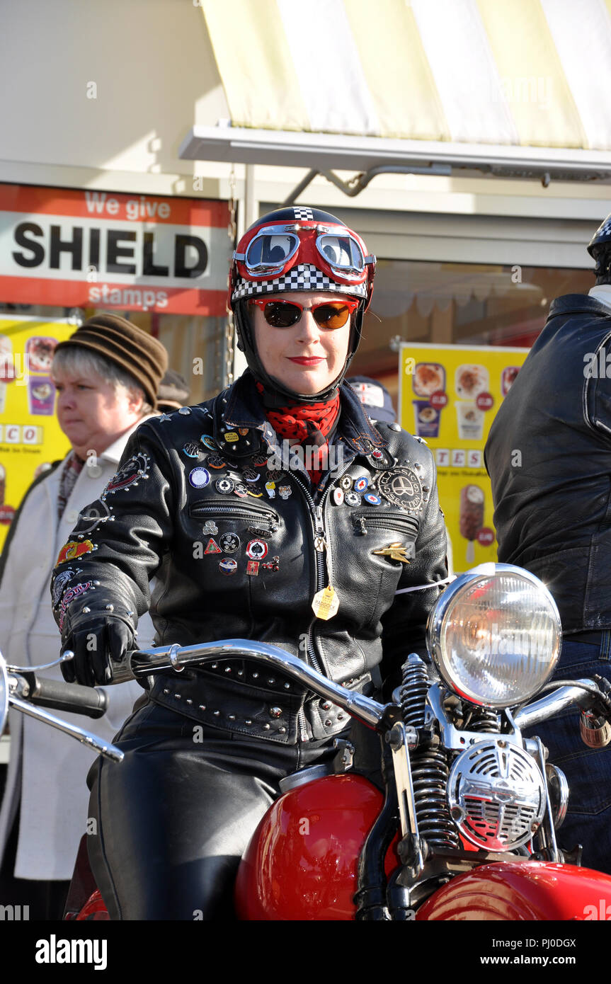 Female period attired motorcyclist in retro leathers at the Goodwood ...