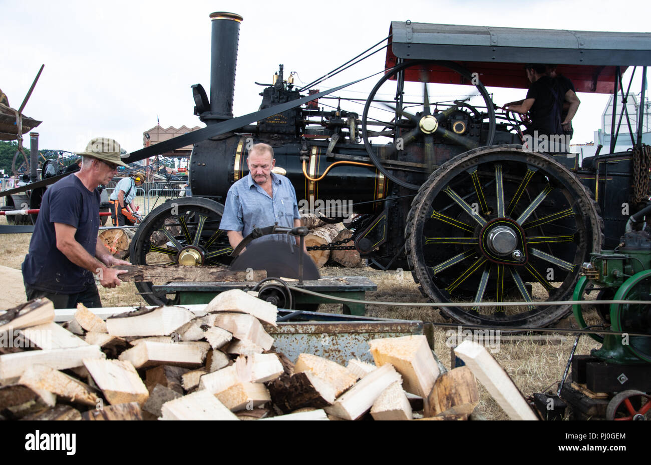 Netley Marsh, United Kingdom - July 21 2018: Two Men cutting wood on a ...