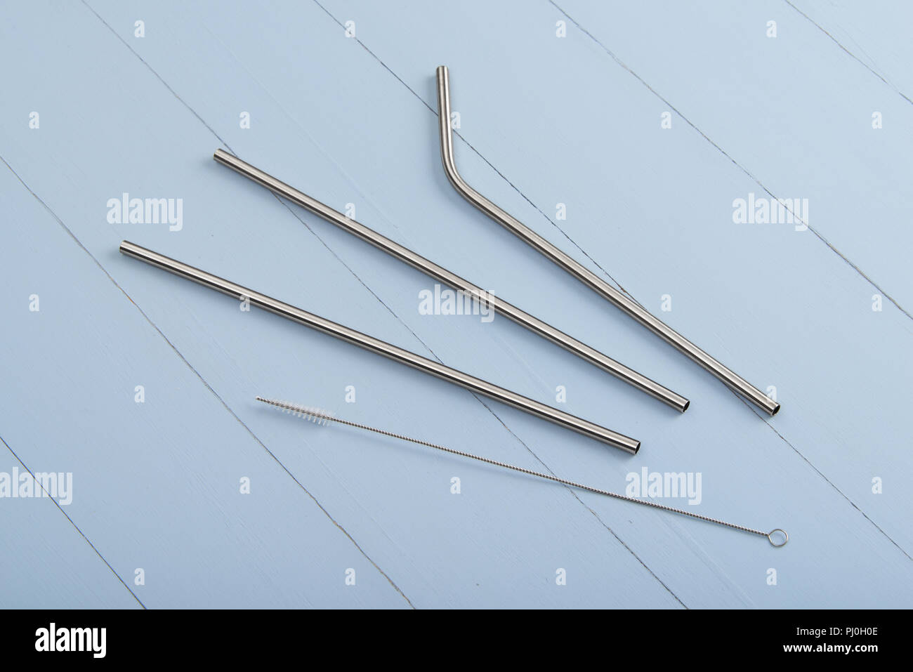 Straight stainless steel bent metal straw with a blue silicone straw ...