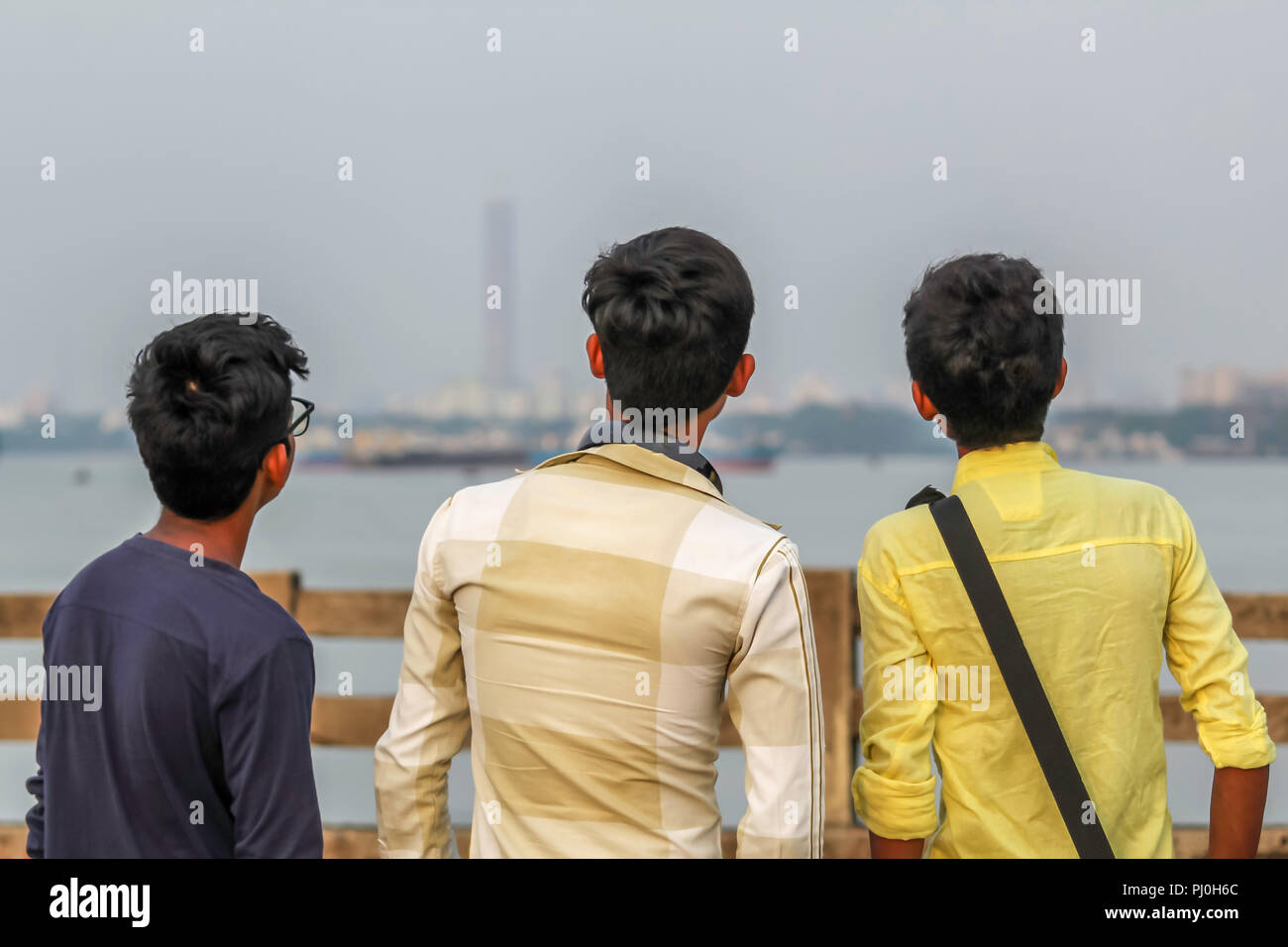 Group of three friends having fun at sunset time. Happy friendship day ...