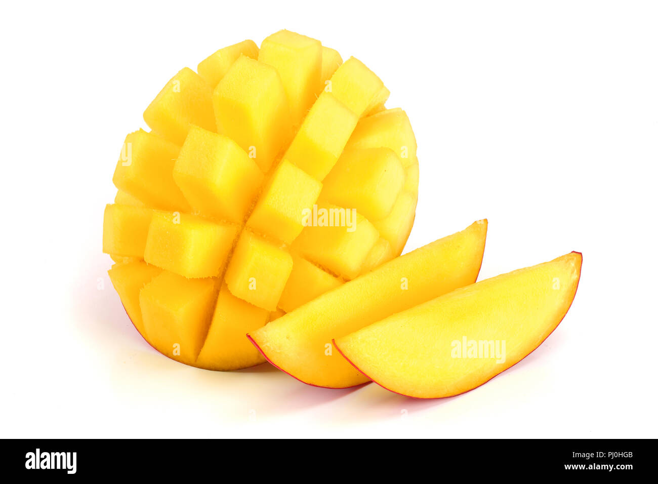 Mango fruit half with slices isolated on white background close-up ...