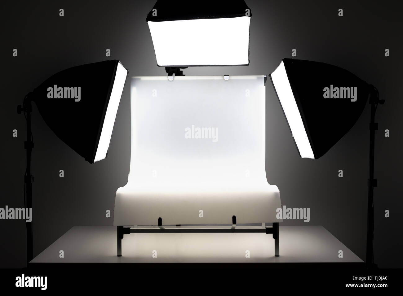 flashlights and shooting table photographic equipment on dark ...