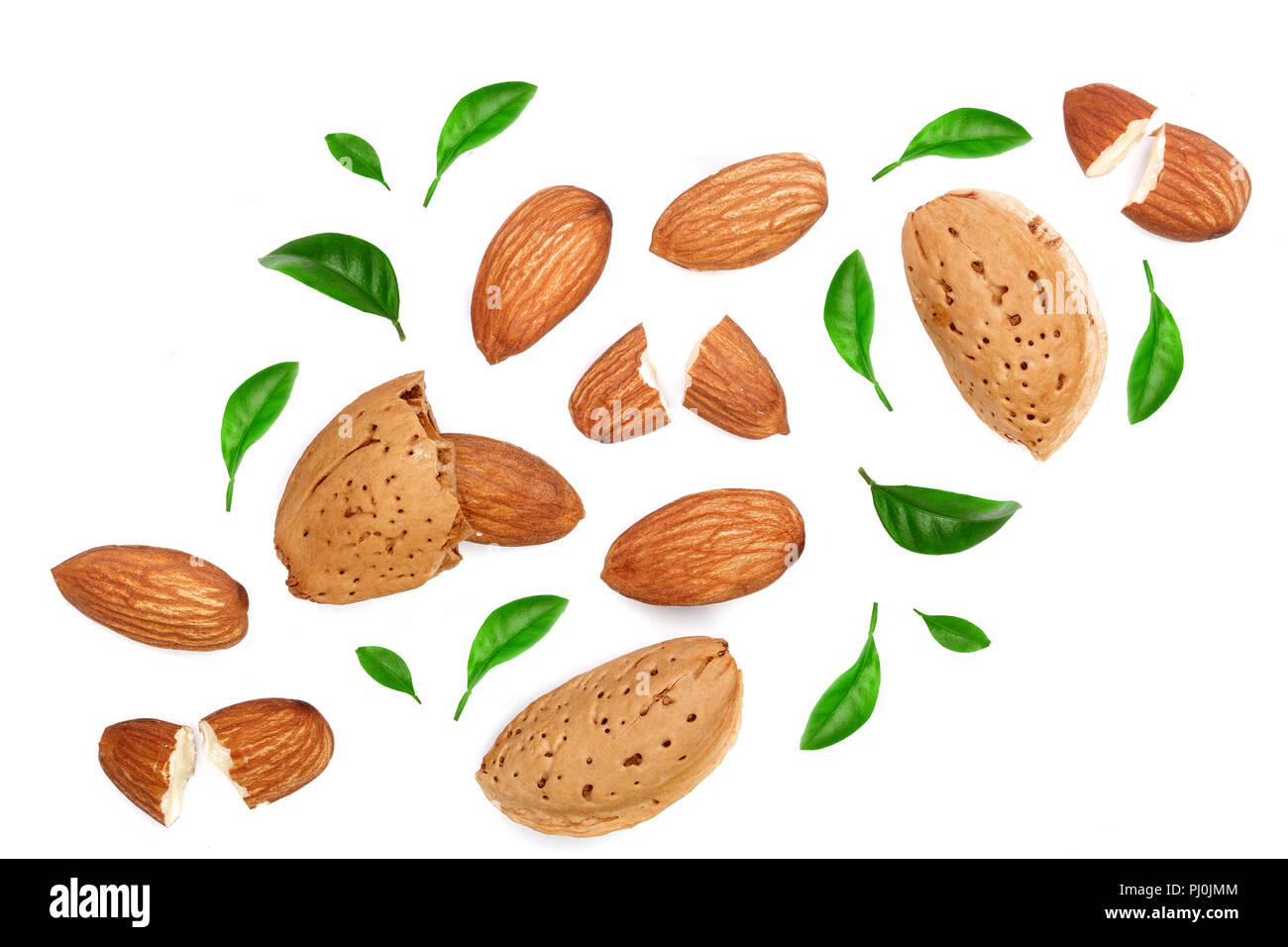 almonds decorated with leaves isolated on white background. Top view ...