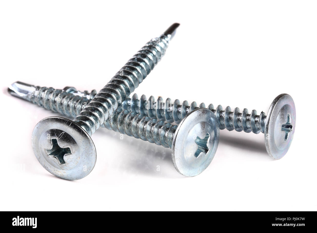 three metal screws isolated on white background closeup Stock Photo - Alamy