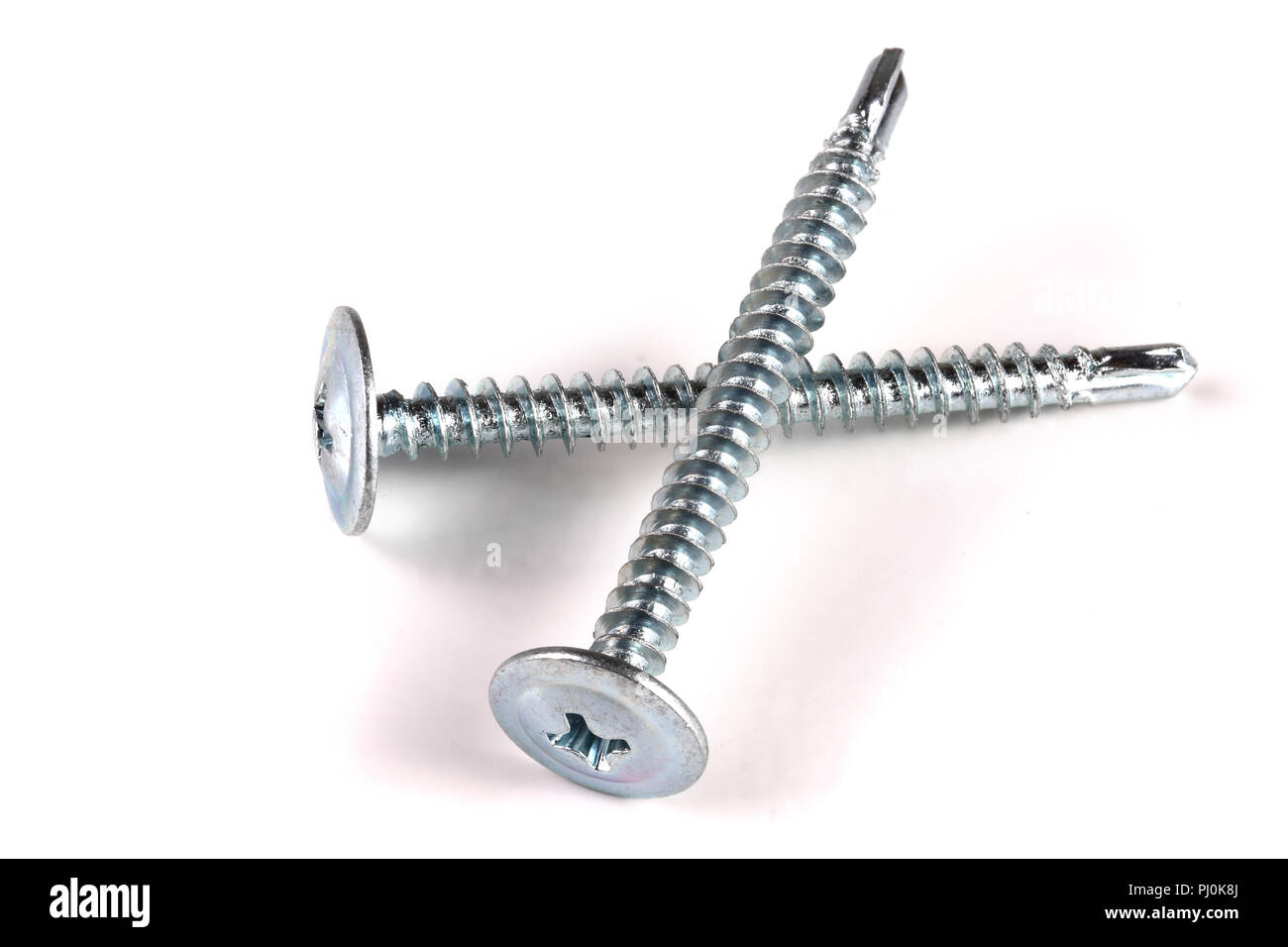 two metal screws isolated on white background closeup Stock Photo - Alamy