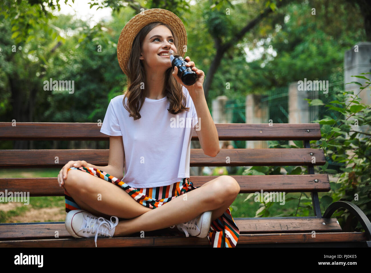 Person sitting drinking fizzy drink hi-res stock photography and images ...