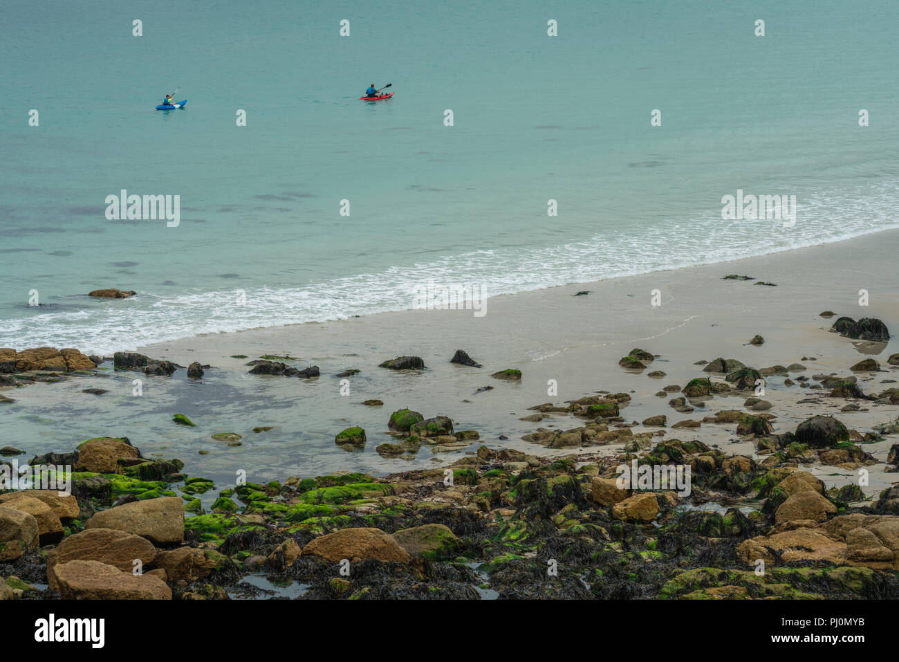 Penwith Heritage Coast, England - May 2018 : People rowing in kayaks in ...