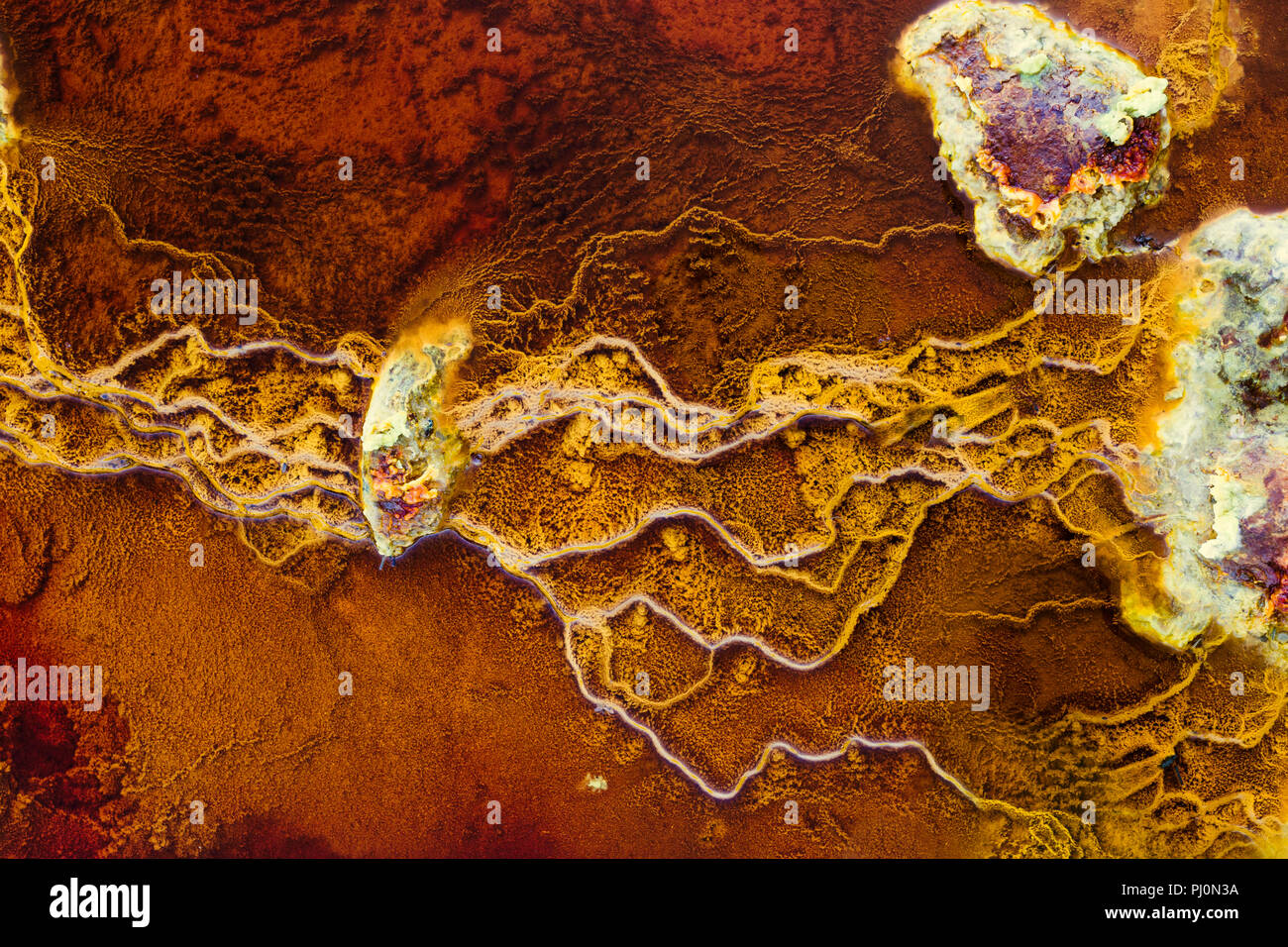 Stones in red waters connected by yellow stromatolites, this ...