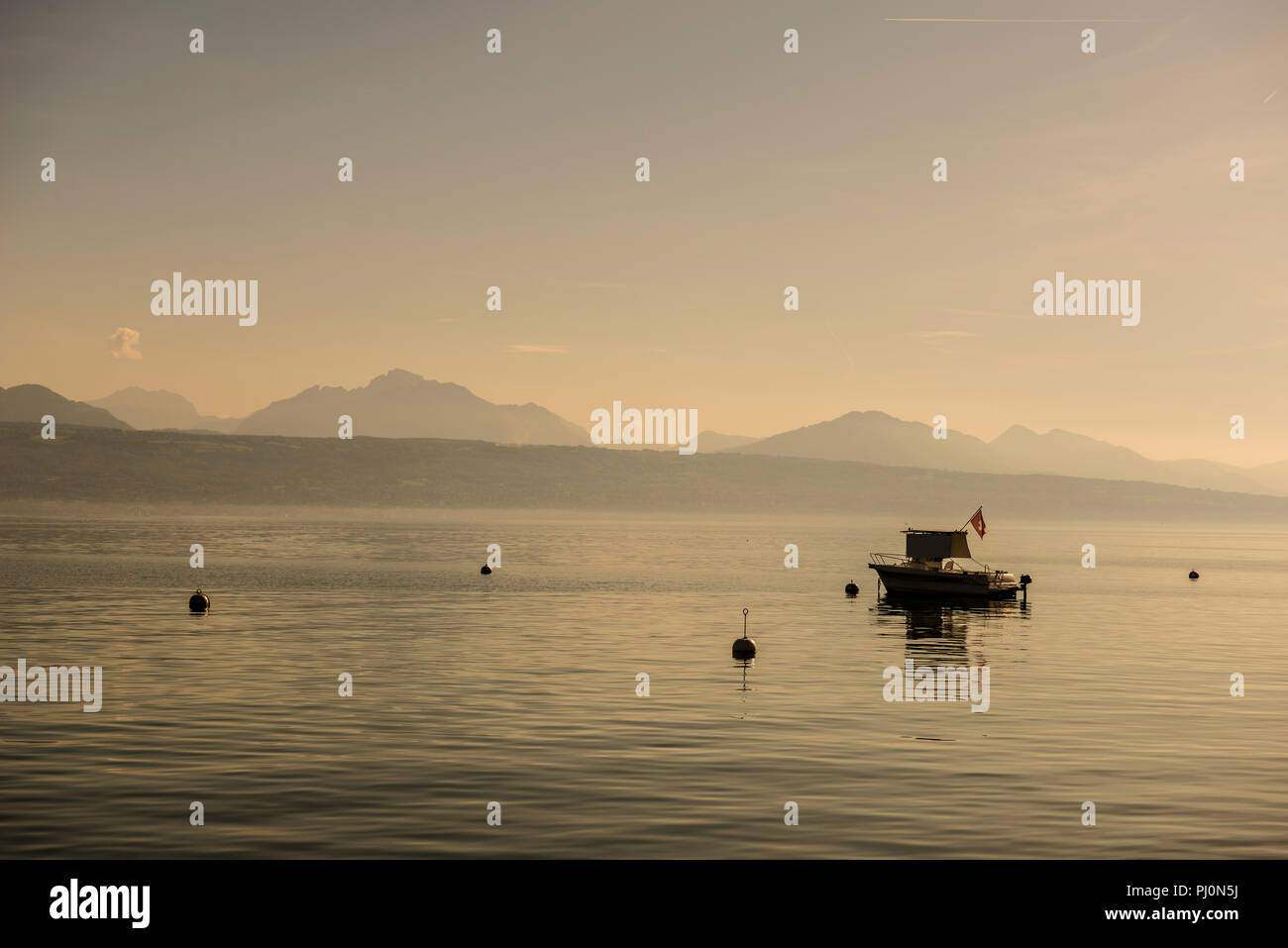Lake Leman and Mountain and a Boat in Lausanne, Switzerland Stock Photo ...