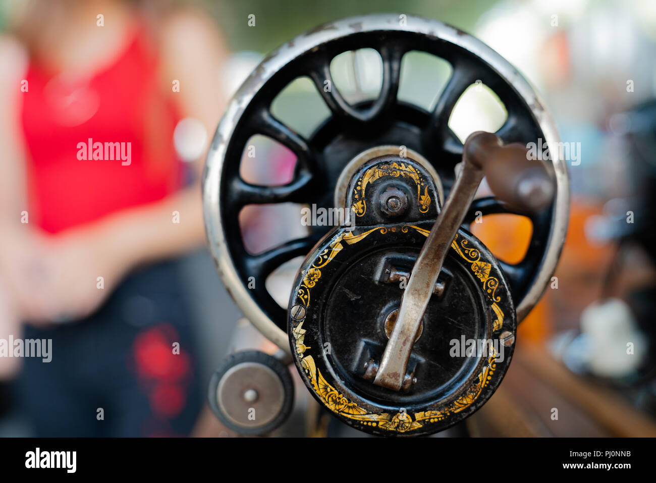 Handle, hand drive and flywheel of an antique sewing machine Stock ...