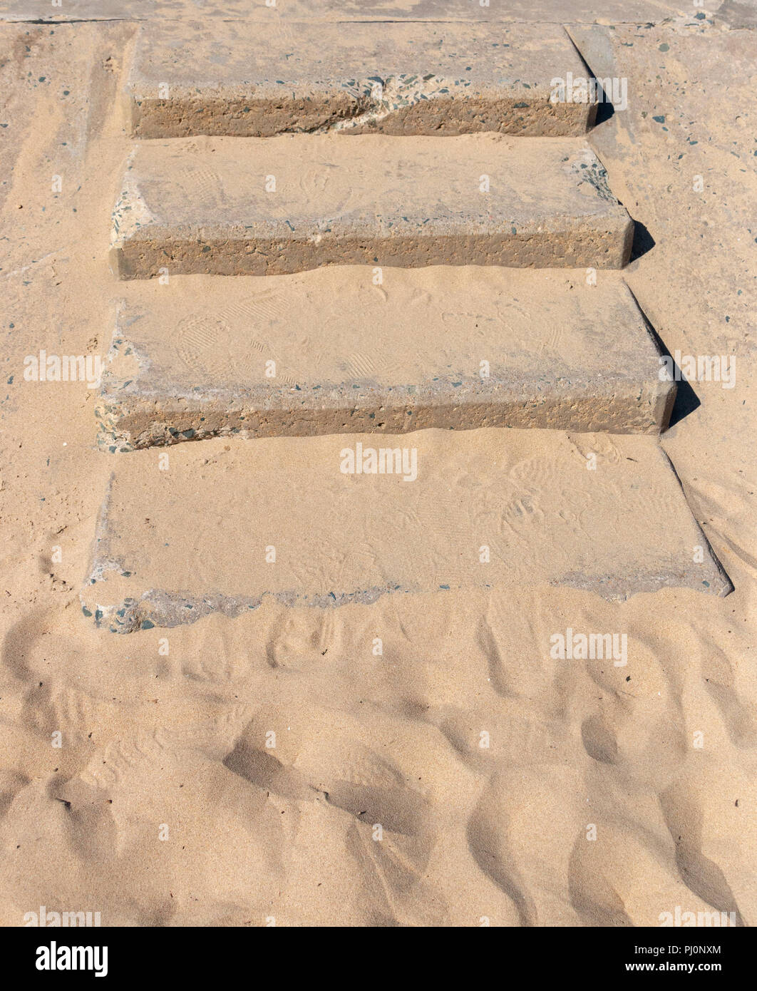 A close up view of concrete stairs on the beginning of the peir on ...