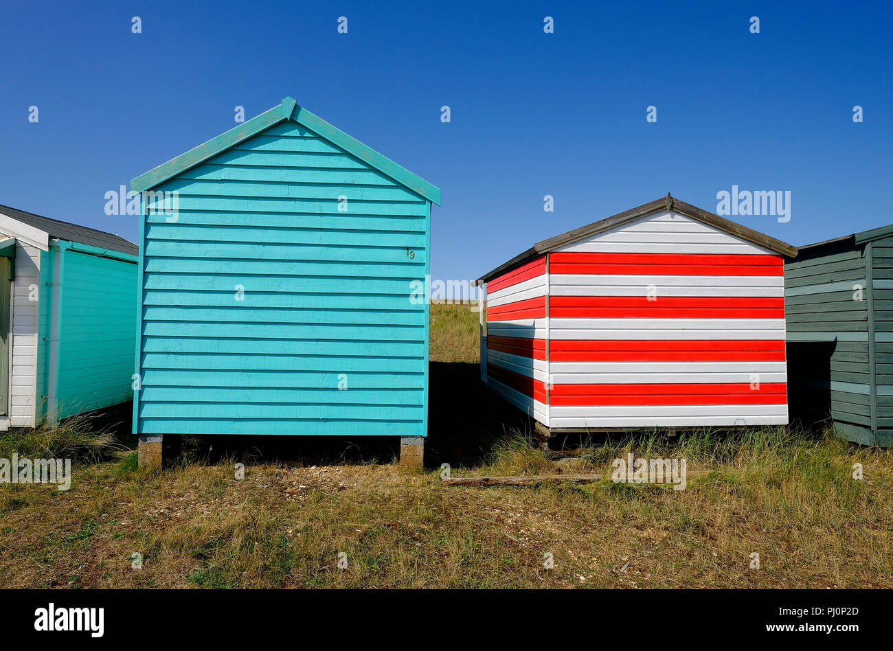 Blue white striped beach huts hi-res stock photography and images - Alamy