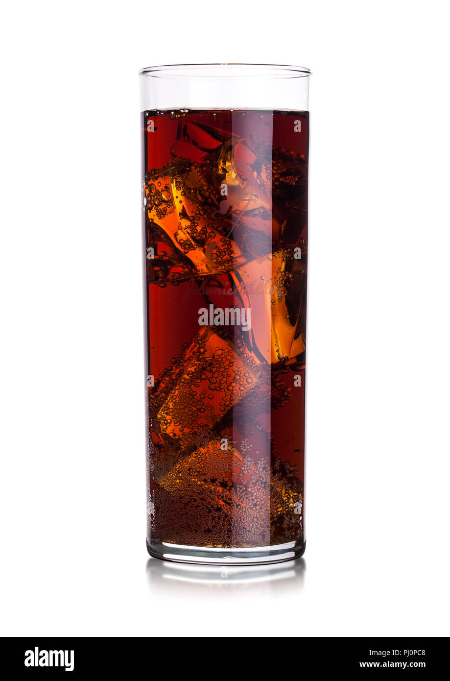 Highball glass of cola soda drink with ice cubes with whiskey and rum on white background Stock ...