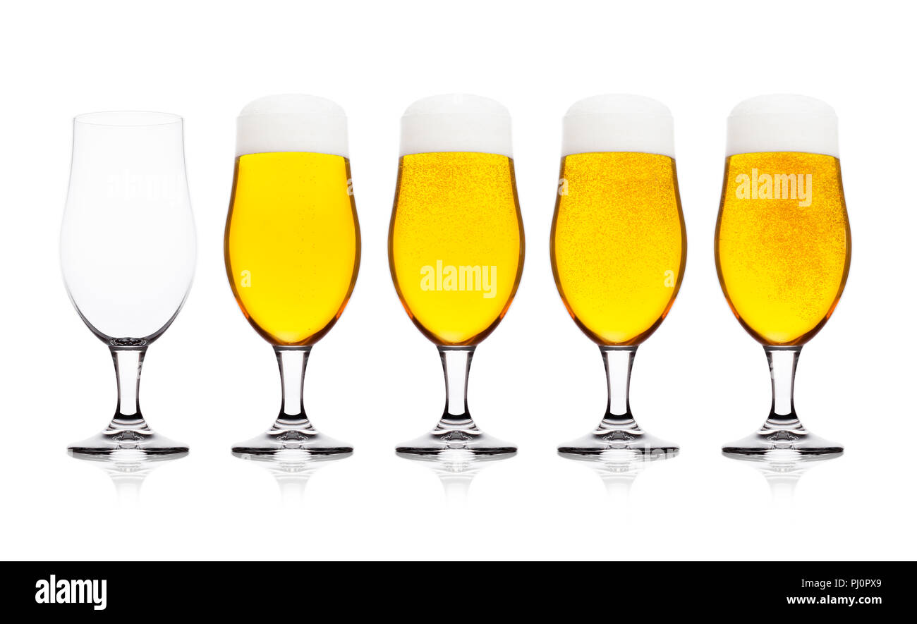 Cold elegant glasses of lager beer with foam and dew isolated on white ...