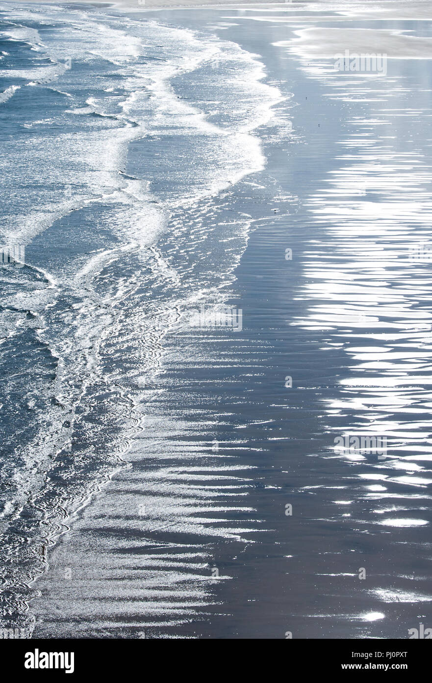 Sunlight on a beautifully sparkling sea shore Stock Photo - Alamy