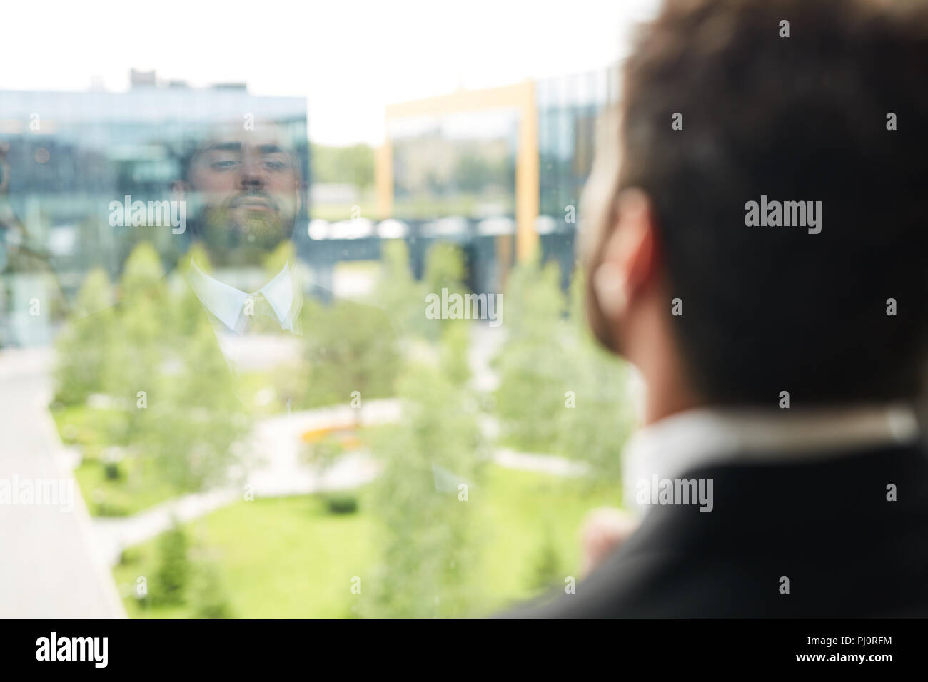 Man facing window hi-res stock photography and images - Alamy